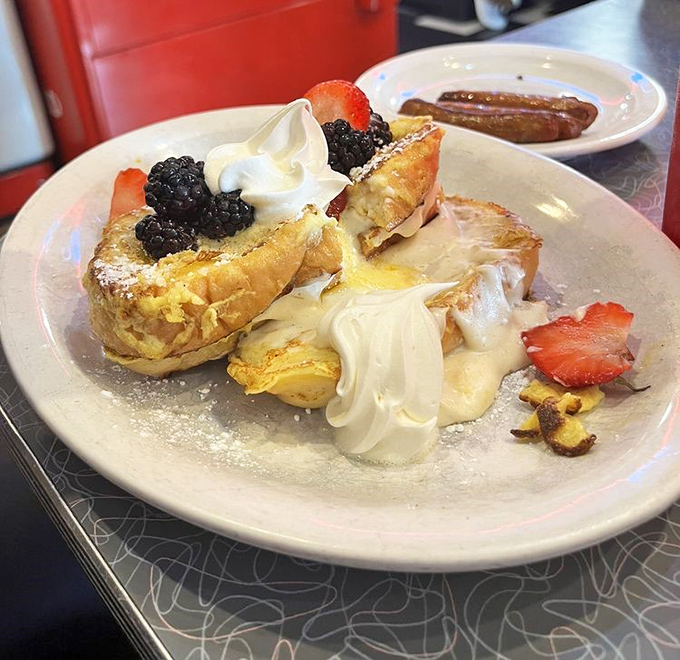 French toast that's having an identity crisis in the best possible way—stuffed, topped, and transformed into something between breakfast and dessert.