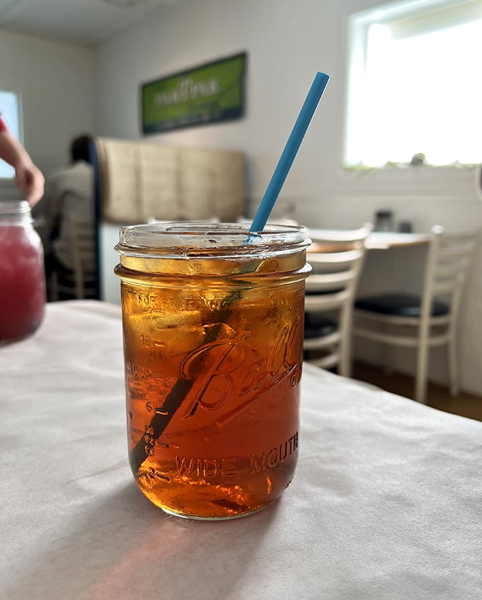 Sweet tea served in a Mason jar isn't just a drink—it's liquid Southern sunshine, offering refreshment with a side of nostalgia.
