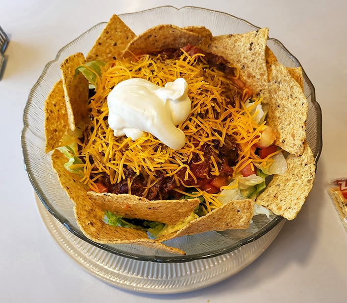 This taco salad bowl isn't just food – it's edible architecture. A crunchy tortilla fortress protecting seasoned beef, cheese, and veggies from the outside world until you demolish it.
