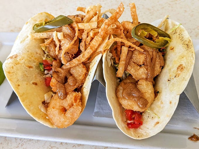 These fish tacos aren't just lunch—they're a vacation on a plate, with crispy fish, fresh vegetables, and those perfectly placed jalapeño slices for adventurous eaters.