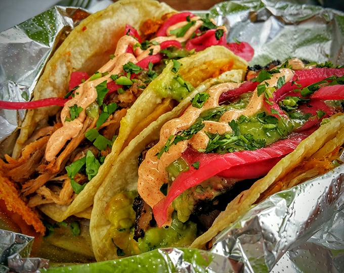 These aren't just tacos—they're smoke-infused flavor vehicles delivering barbecue goodness wrapped in hand-held happiness.