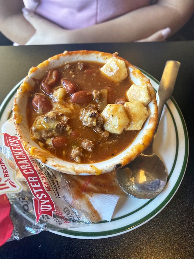 The tavern chili comes loaded with beans, ground beef, and potatoes—a hearty bowl that could convert even the most dedicated Texas chili purist.