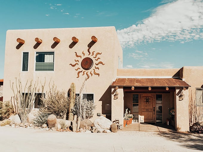 Desert architecture at its finest: adobe walls, wooden beams, and that iconic sun symbol – Mother Nature's thermostat built right into the design.