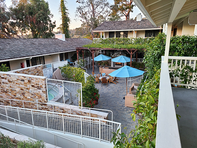 The courtyard at Hotel Carmel offers that perfect blend of privacy and sunshine – the outdoor living room you wish you had at home.