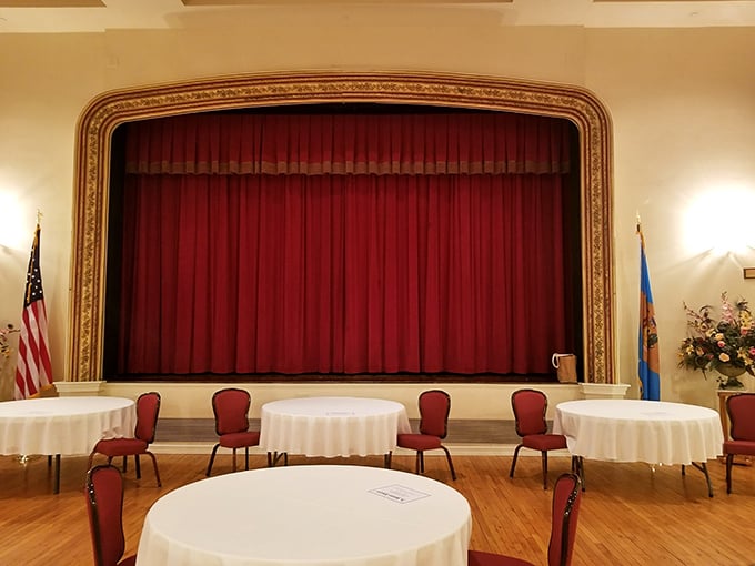 The Opera House stage where community theater thrives and parking is actually possible – imagine that!