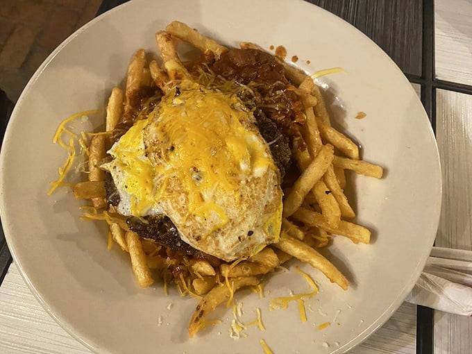 The St. Louis Slinger: a glorious mess of fries topped with chili and a sunny-side-up egg—the ultimate hangover cure or indulgent splurge.