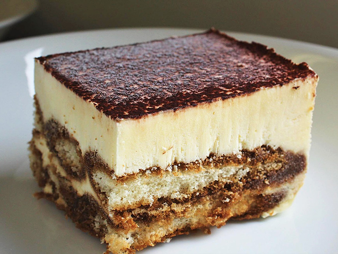 Tiramisu that looks so perfectly layered it could teach a geology class – each stratum promising its own delicious revelation.