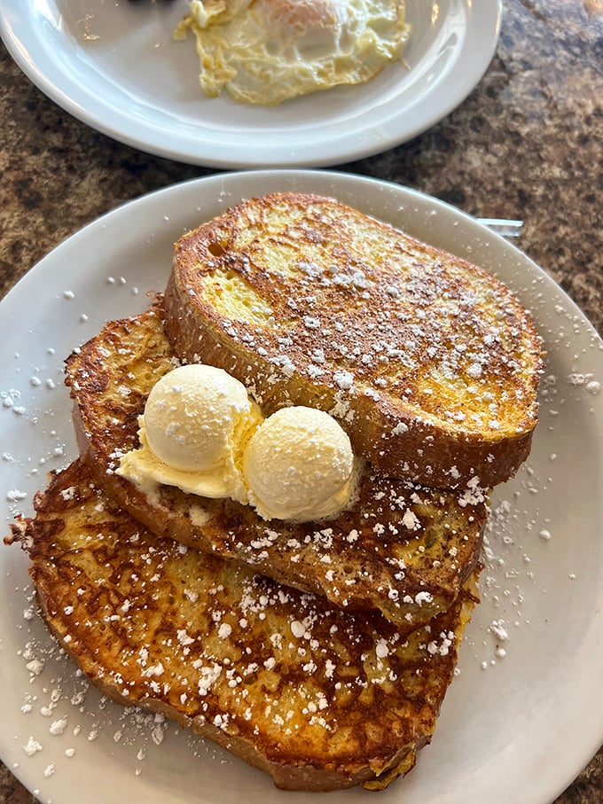 French toast that makes ordinary bread realize its true potential—like a carb Cinderella story with butter as the fairy godmother.