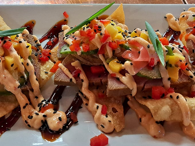 These tostadas are architectural marvels – crispy platforms supporting layers of flavor, drizzled with sauce that ties everything together like a culinary conductor.