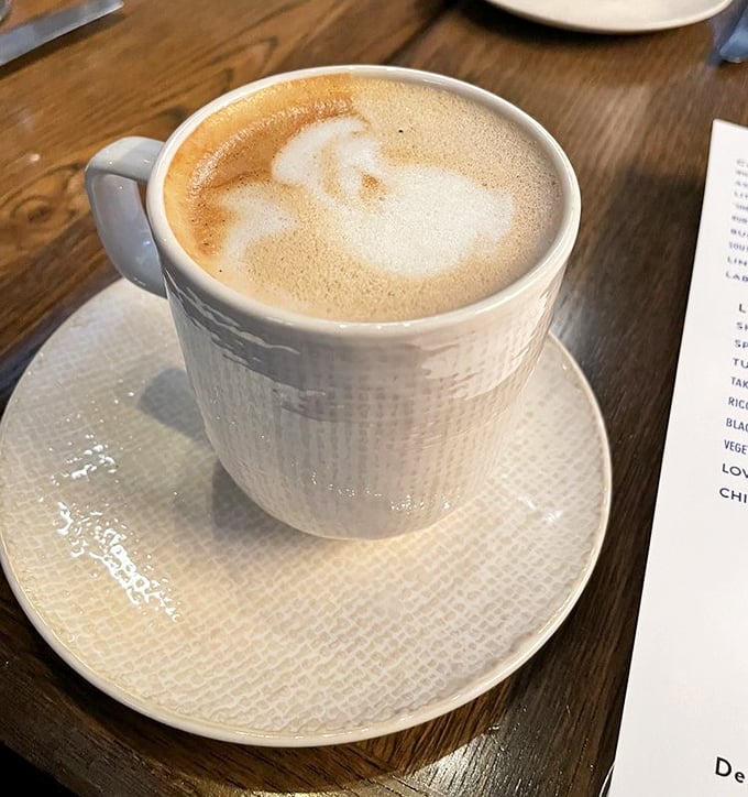 Even their coffee gets the royal treatment – a vanilla latte served in a textured cup that feels like it belongs in your favorite aunt's china cabinet.