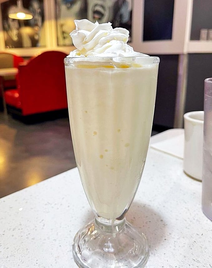 Their vanilla milkshake stands tall and proud, topped with a cloud of whipped cream—proof that sometimes the classics need absolutely no improvement.