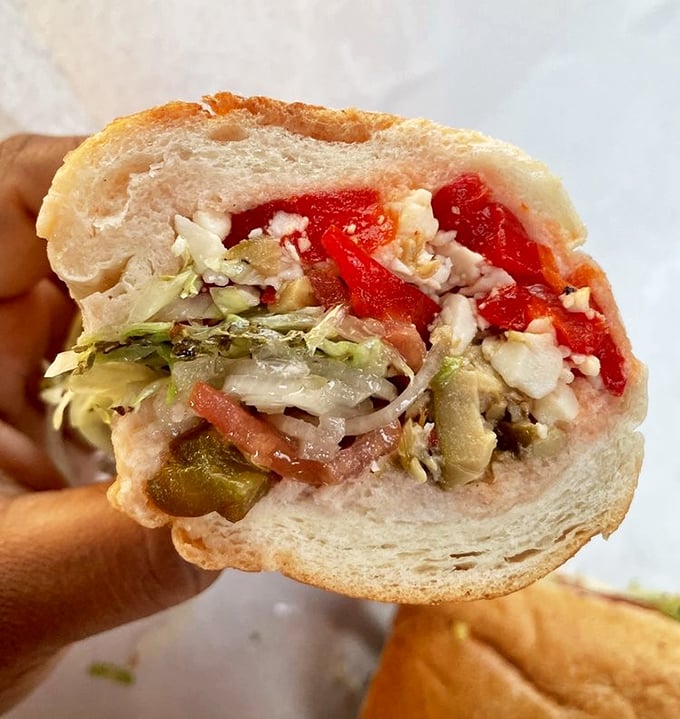 A masterclass in texture and balance—crisp vegetables nestled against soft bread with just enough dressing to unite the ingredients.