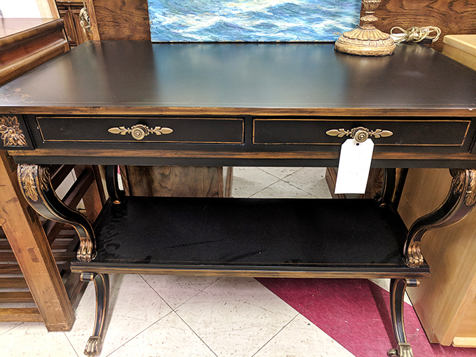 This elegant console table whispers tales of cocktail parties past, when "mixed drinks" meant more than just combining yesterday's coffees.