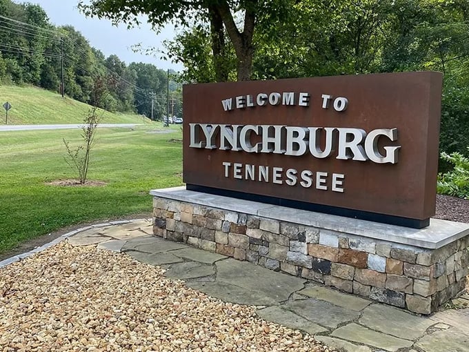 "Welcome to Lynchburg, Tennessee" – six words that promise authentic experiences. This rustic sign marks the threshold to a town that punches above its weight.