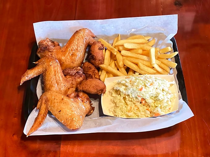 Wings that don't need a sporting event excuse, served with fries and slaw—a plate that says "today is special enough."