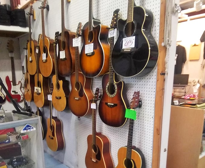 Guitar heaven for pickers and grinners. Each instrument hanging here has stories to tell and songs yet to play.