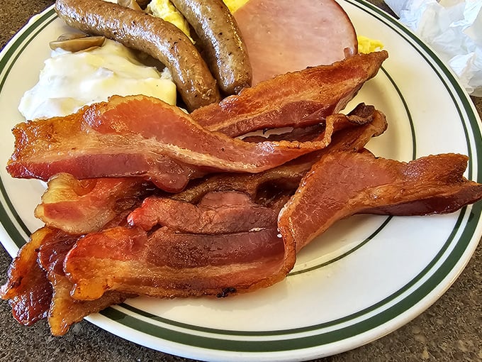 Bacon that doesn't just sizzle but performs—crispy, substantial strips that make breakfast feel like the main event it deserves to be.
