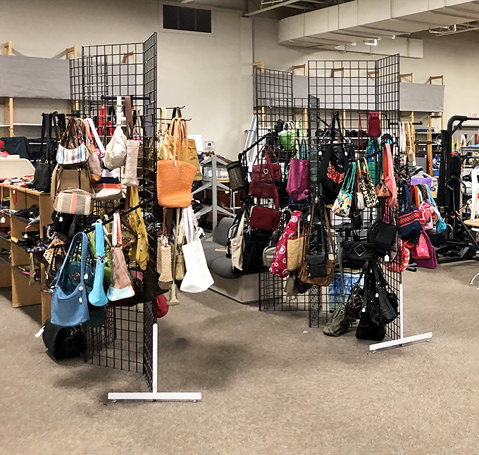 Handbag heaven! Like a colorful garden of purses blooming on metal trellises, waiting to be picked.