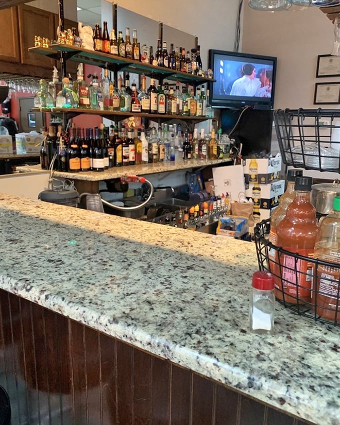 The bar isn't just stocked – it's a liquid library of possibilities, with bottles standing at attention ready to complement your Filipino feast. 