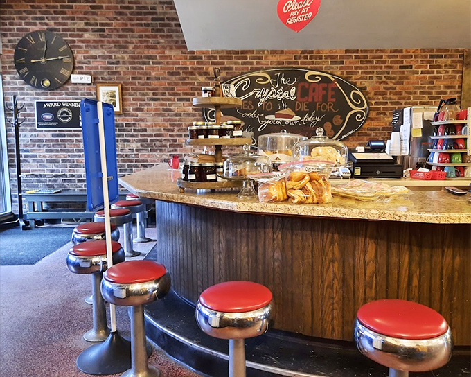 The counter where regulars become family. That "Crystal Cafe: TO DIE FOR" sign isn't hyperbole—it's a warning your diet plans might need rescheduling.