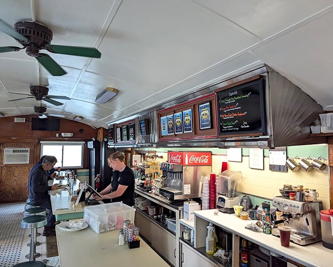 The heart of diner operations—where coffee flows like conversation and the soda fountain stands ready to fulfill childhood nostalgia with adult permission.