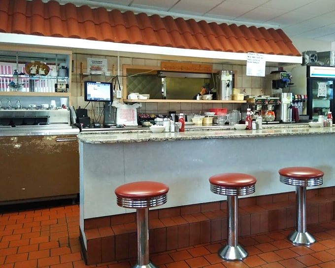 The counter seats—where solo diners become temporary family and the short-order ballet unfolds before your appreciative eyes.