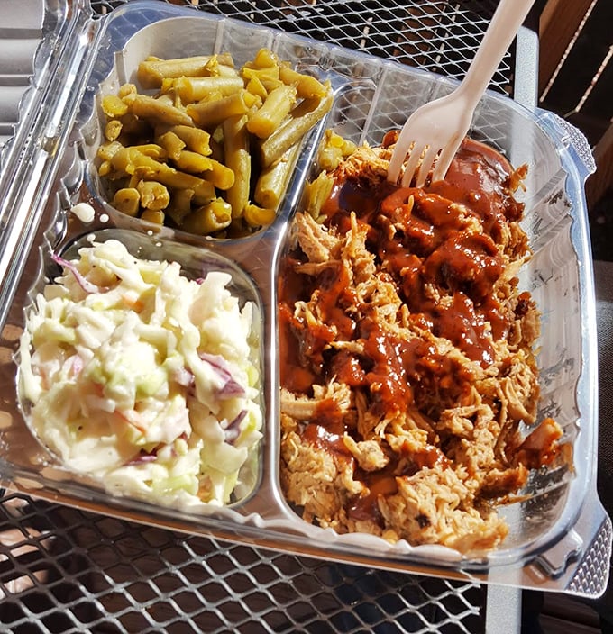 A three-compartment container has never held such treasure – pulled pork with sauce that's not just an accessory but an essential part of the ensemble.