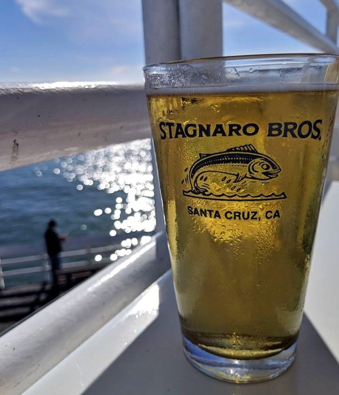 That golden beer with an ocean view – proof that sometimes life really is a commercial.