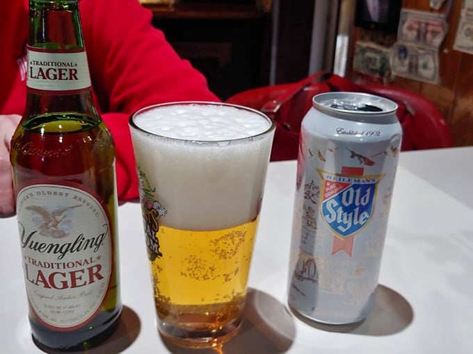 Cold beer and good company – the universal language of neighborhood taverns everywhere. Yuengling and Old Style standing by for pizza duty.