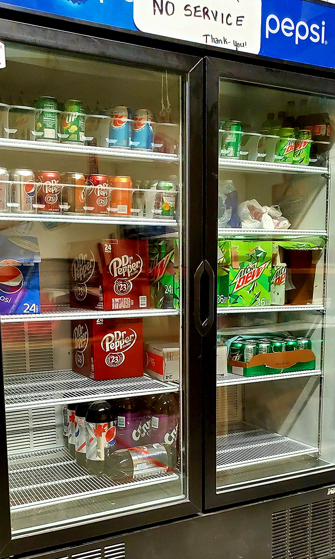 The beverage cooler—where decisions are simpler than streaming services but just as satisfying. Dr Pepper seems to be the local favorite.