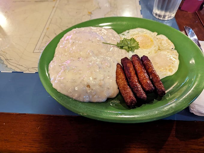 Biscuits and gravy – the breakfast that hugs you from the inside out, with sausage links standing at attention like delicious sentinels.