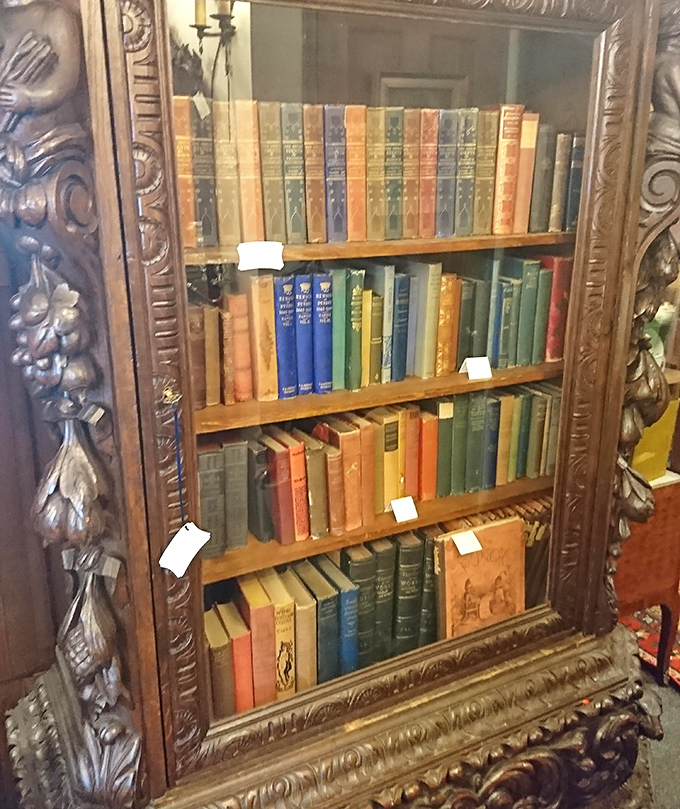 Behind this ornately carved bookcase door lies literary history—leather-bound volumes whose pages have been turned by generations of curious minds.