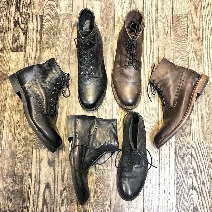 A leather boot lineup that would make a cowboy weep – each pair with enough character to star in its own Netflix series.