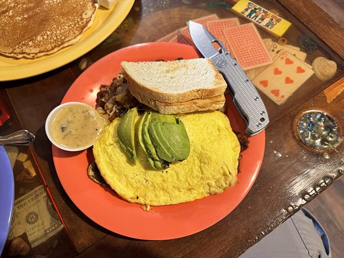 When breakfast can't decide what it wants to be, it becomes this glorious platter—eggs, avocado, and toast in perfect harmony.