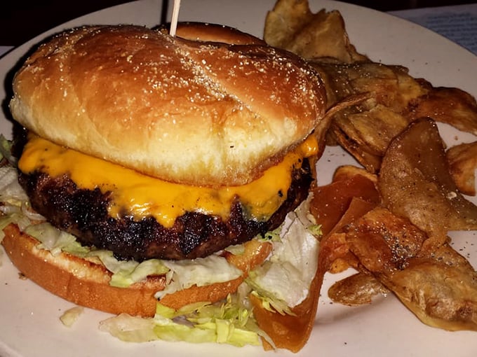 This isn't just a burger; it's a masterclass in simplicity. Perfectly charred patty, melted cheese, and those house-made chips deserve their own fan club.