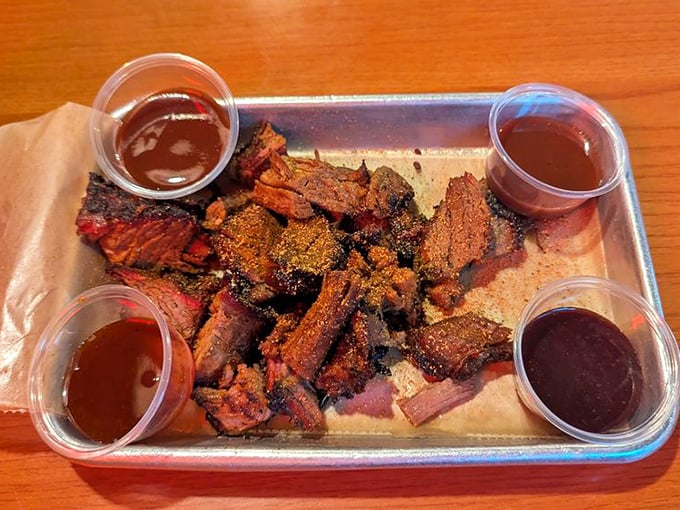 Burnt ends – those caramelized, flavor-packed morsels of brisket heaven surrounded by a quartet of sauces for dipping adventures.