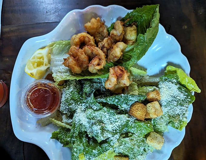A Caesar salad that doesn't apologize for being a salad. Crisp romaine, golden croutons, and perfectly fried shrimp make this green dish worth ordering.