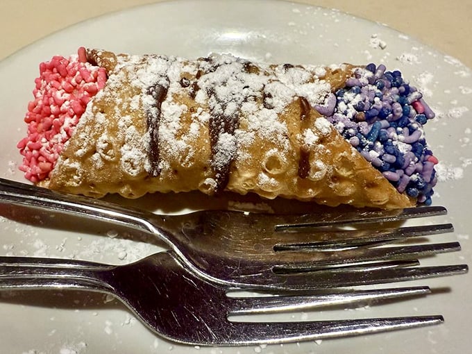 A cannoli with sprinkles that doesn't just end your meal—it throws a tiny, powdered-sugar parade in your honor.