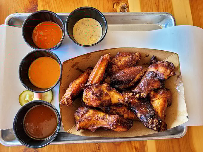 Smoked wings with a lineup of sauces that make choosing just one an existential crisis worth having.