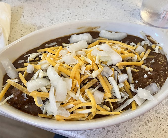 Chili so hearty it could warm a Cardinals fan during an April rain delay, topped with the democratic balance of cheese and onions.