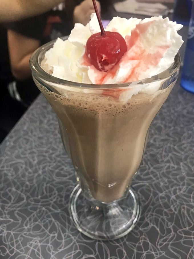 A milkshake so thick and creamy it demands both a straw and a spoon. The cherry on top isn't just garnish—it's a promise.