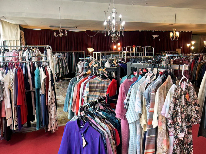 The vintage clothing section sparkles under chandeliers that have illuminated decades of fashion. Even the lighting fixtures here have impressive résumés.