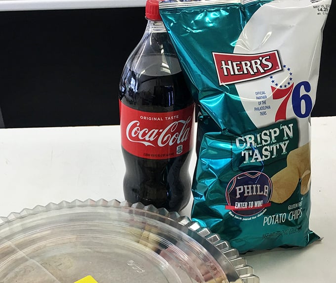 The perfect sidekick to any sandwich adventure. Nothing cuts through cheesesteak richness like an ice-cold Coke and Herr's chips.