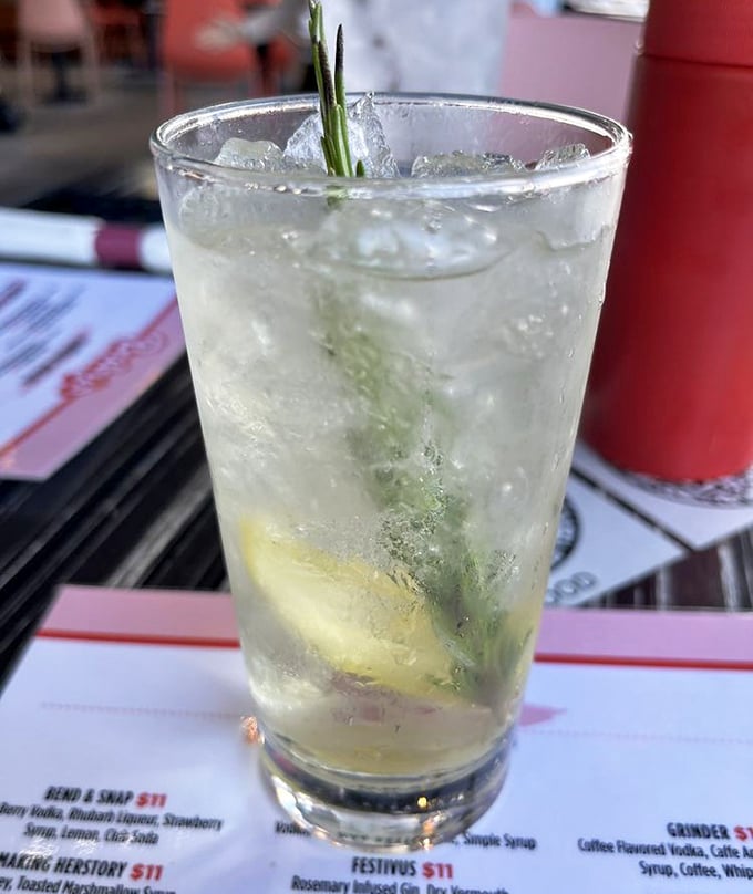 A cocktail that looks deceptively simple but, like a good conversation, reveals surprising depth with each sip – note that sprig of rosemary standing guard.