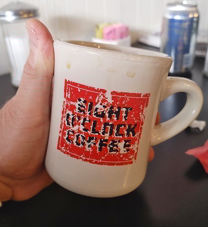 The coffee mug says it all—this isn't artisanal single-origin anything. It's honest diner coffee that gets the job done, cup after glorious cup.