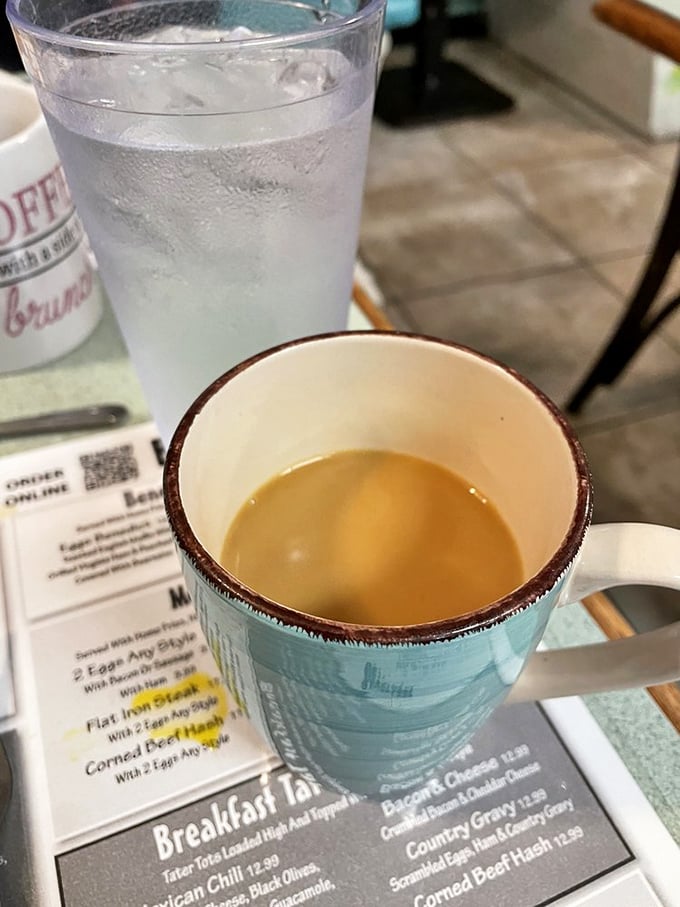 That turquoise mug isn't just serving coffee; it's delivering liquid motivation with a side of Keys-style optimism.