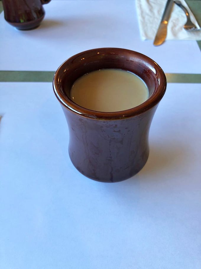 The coffee comes in a sturdy mug that means business—no pretentious vessels here. This is the kind of honest brew that fuels Tampa's morning conversations.