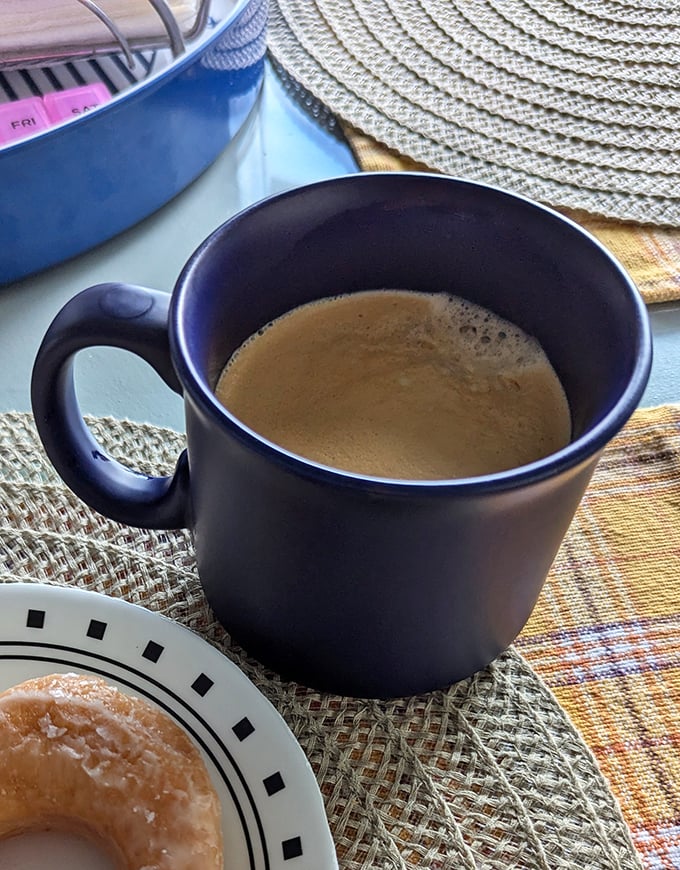 The perfect companion to fried dough—a steaming cup of coffee in a no-nonsense mug. Some relationships are simply meant to be.
