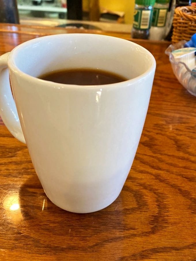 The humble coffee mug—vessel of morning salvation. At Leo's, they understand that prompt refills are not just good service but a moral obligation.
