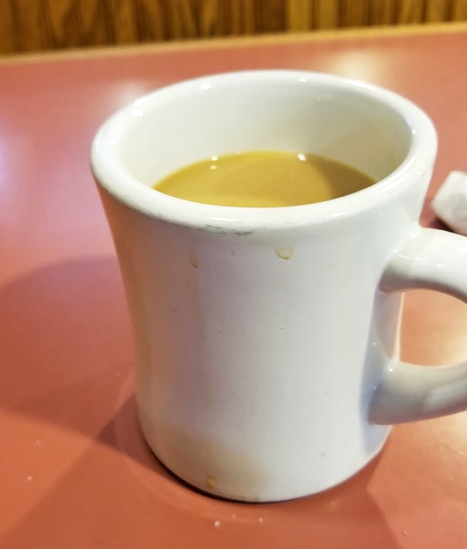 Coffee served in proper diner mugs – because fancy cups are for people who don't understand morning priorities.